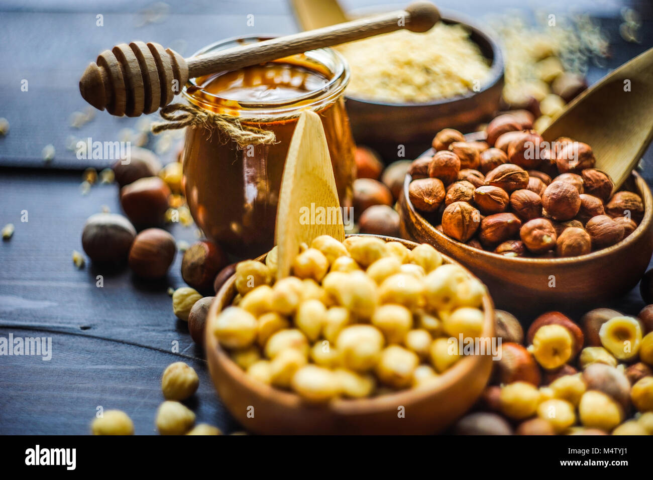 Different types of hazelnuts on dark wooden background with copyspace ...