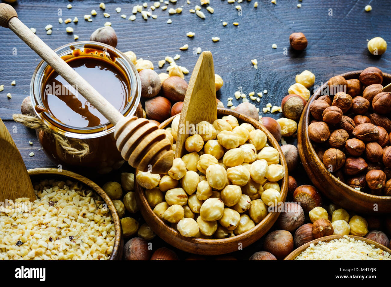 Different types of hazelnuts on dark wooden background with copyspace ...