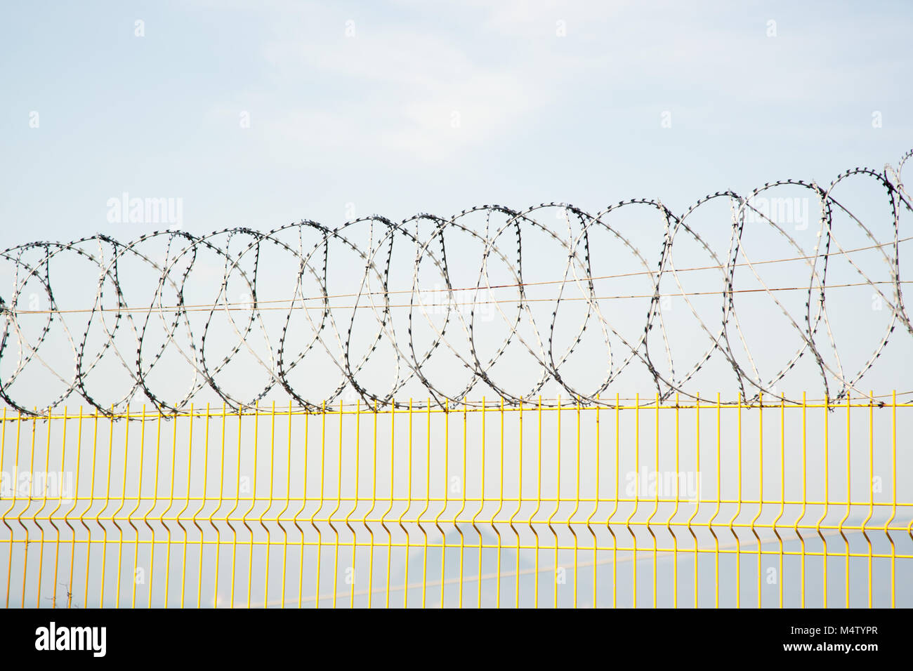 Protection with a barbed wire on it Stock Photo - Alamy