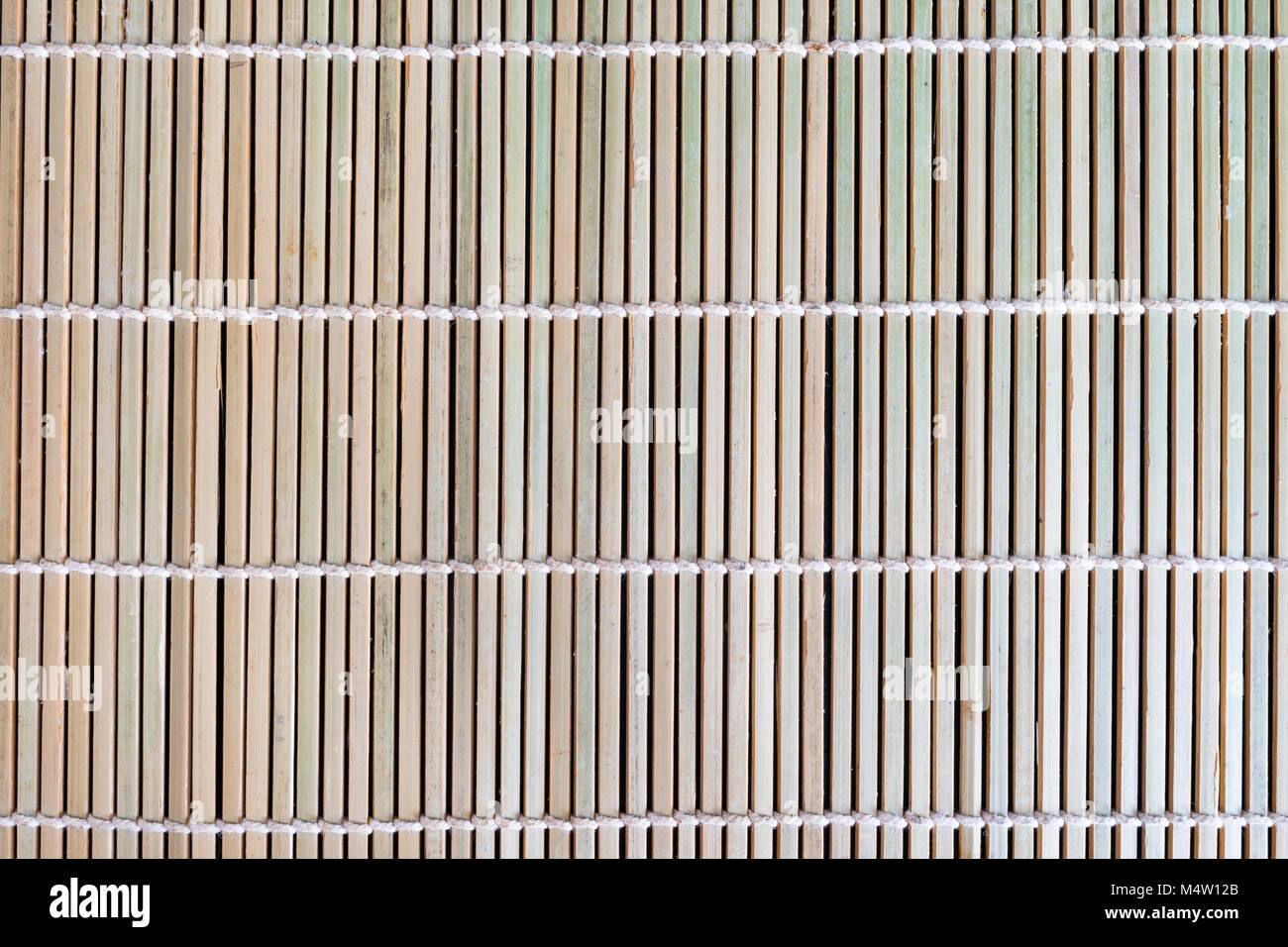 Old mat made by natural bamboo sticks and tied up between each other ...