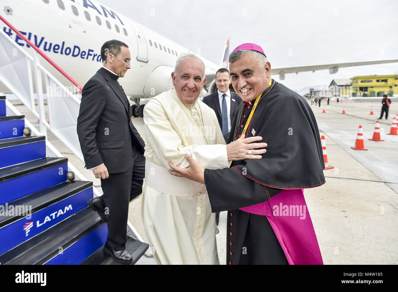 Pope Francis is welcomed on his arrival at the airport of Iquique ...