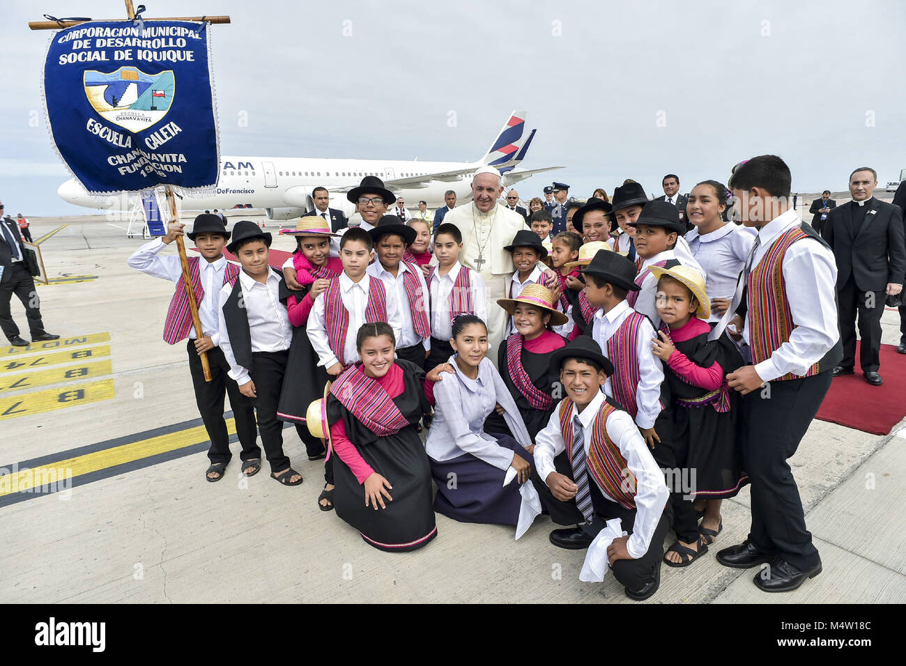 Pope Francis is welcomed on his arrival at the airport of Iquique ...