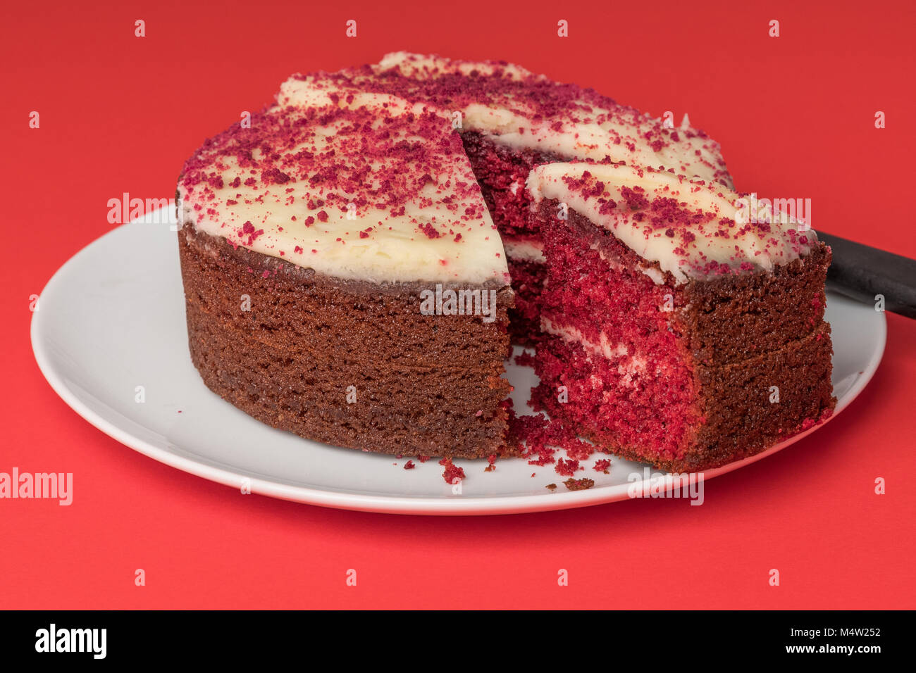 A red velvet cake - red background Stock Photo - Alamy