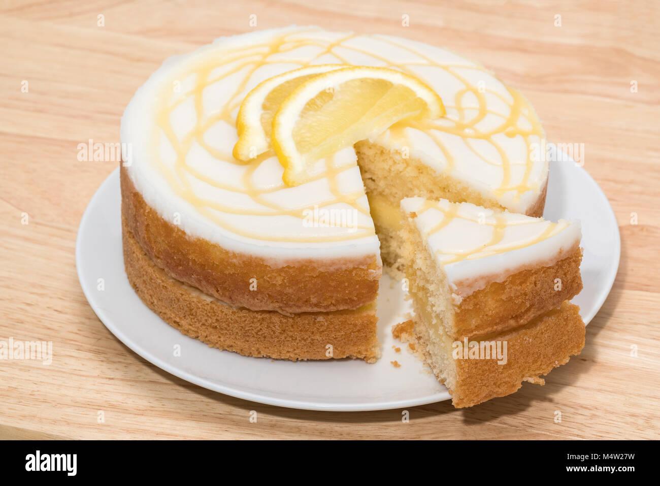 A lemon drizzle cake Stock Photo - Alamy
