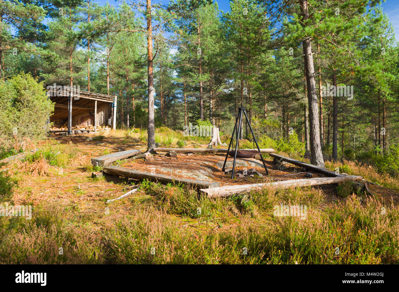 Small one side open, wooden hunting hut with bonfire place, in ...