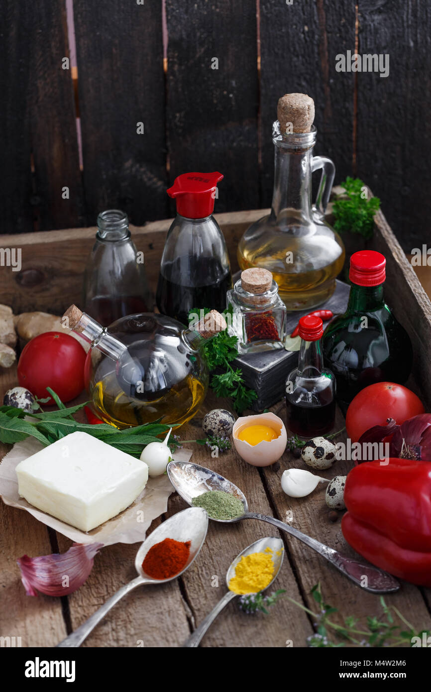 Big set of sauces and spices, with vegetables in a wooden box Stock ...