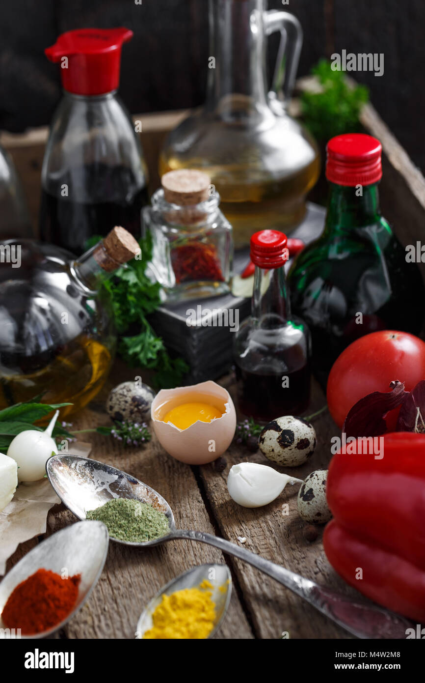 Big set of sauces and spices, with vegetables in a wooden box Stock ...