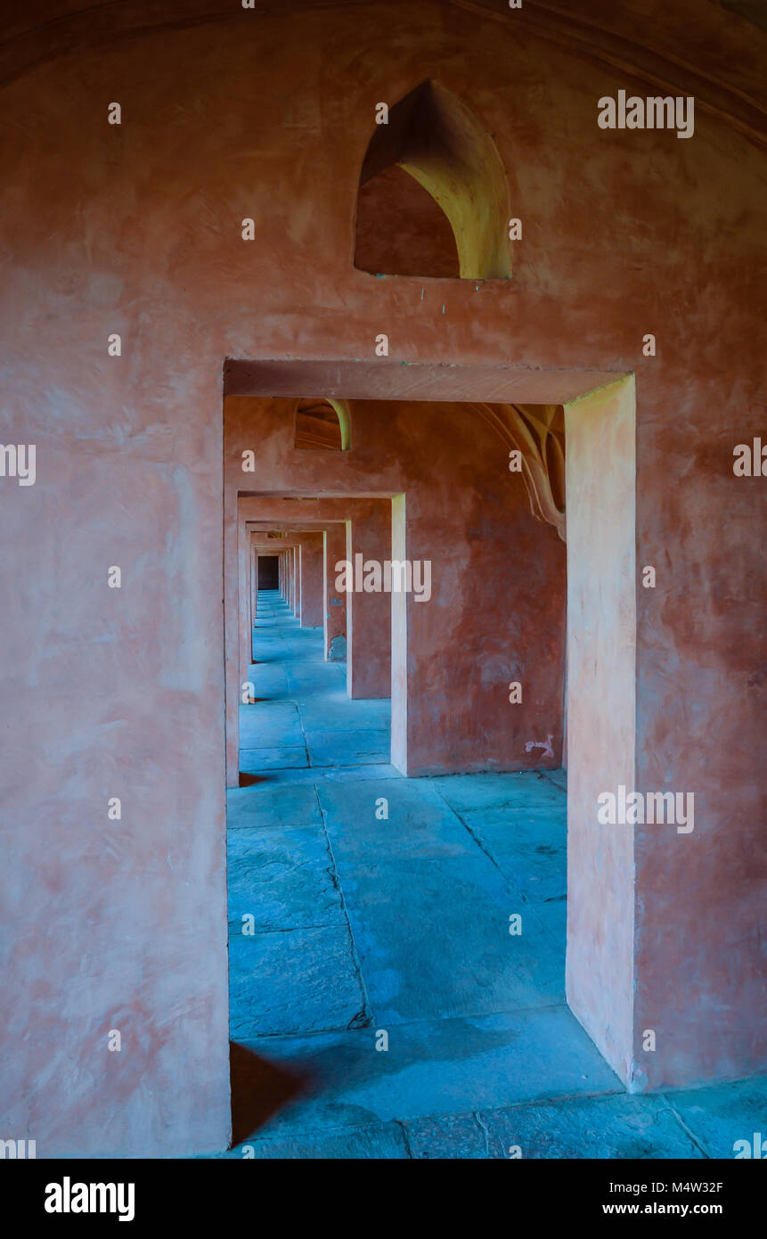 Terracotta color rectangular doorway repeating pattern topped by ...