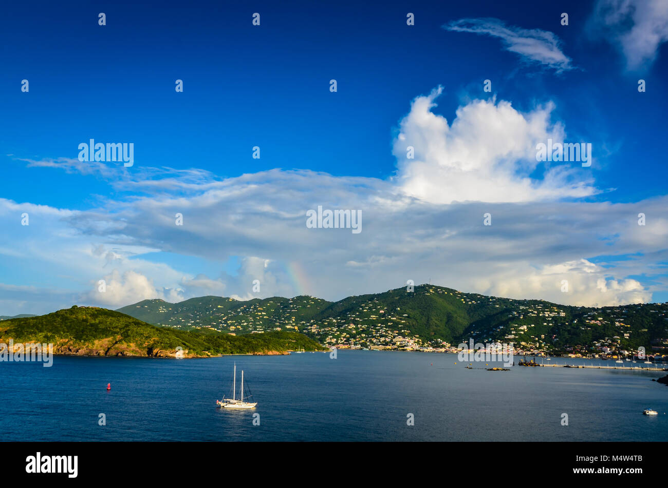 Charlotte Amalie, St. Thomas, USVI. Sailboat and hills of waterfront ...