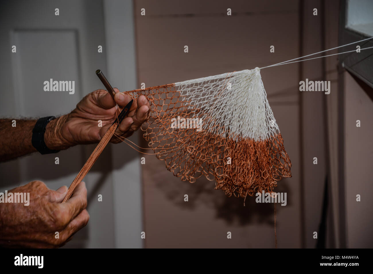 Corossol, St. Barths. Traditional craft of making a fishing seine, a ...