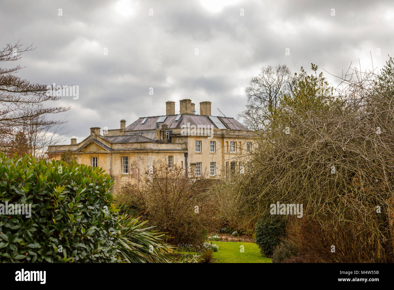 Painswick House with flagstone paved patio terrace and box hedges ...