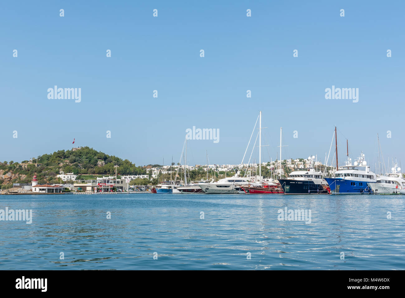 View of Marine with luxury yachts and sail yachts in Bodrum harbor ...