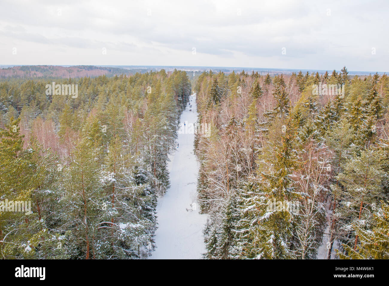 City Ogre, Latvia. Peoples and old sand quarry at city Ogre. Snow and ...
