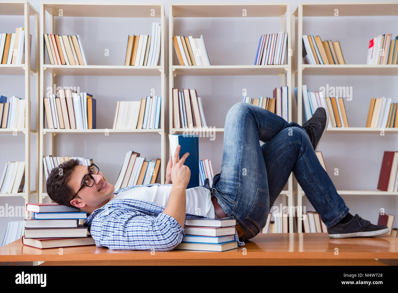 Young student taking break and falling asleep Stock Photo - Alamy