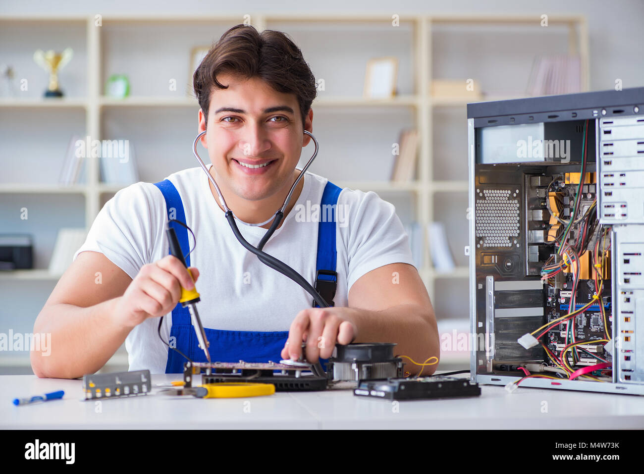Computer repairman repairing desktop computer Stock Photo - Alamy