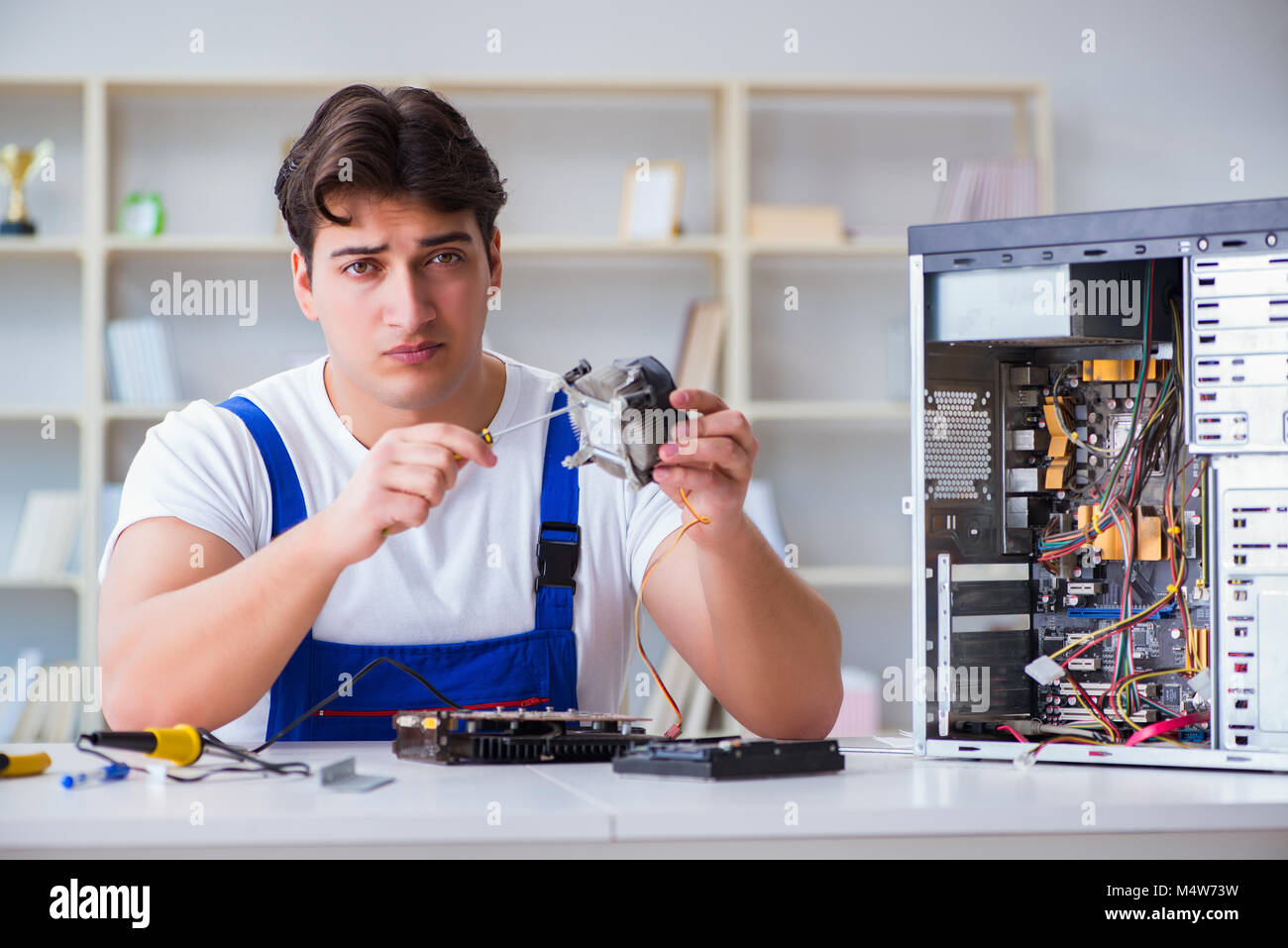 Computer repairman repairing desktop computer Stock Photo - Alamy