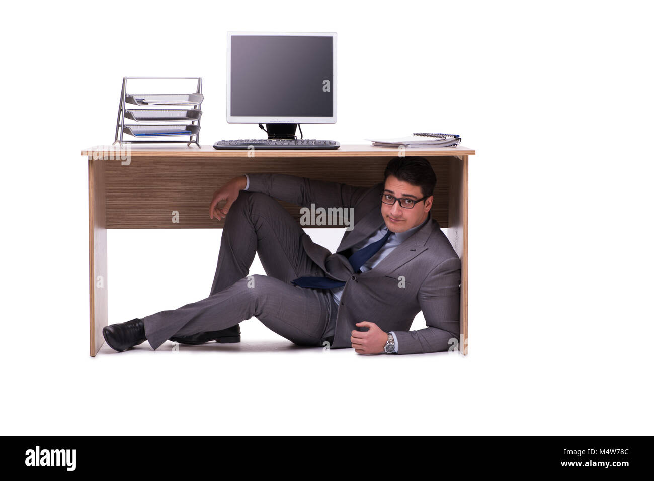 Businessman hiding in the ofice Stock Photo - Alamy