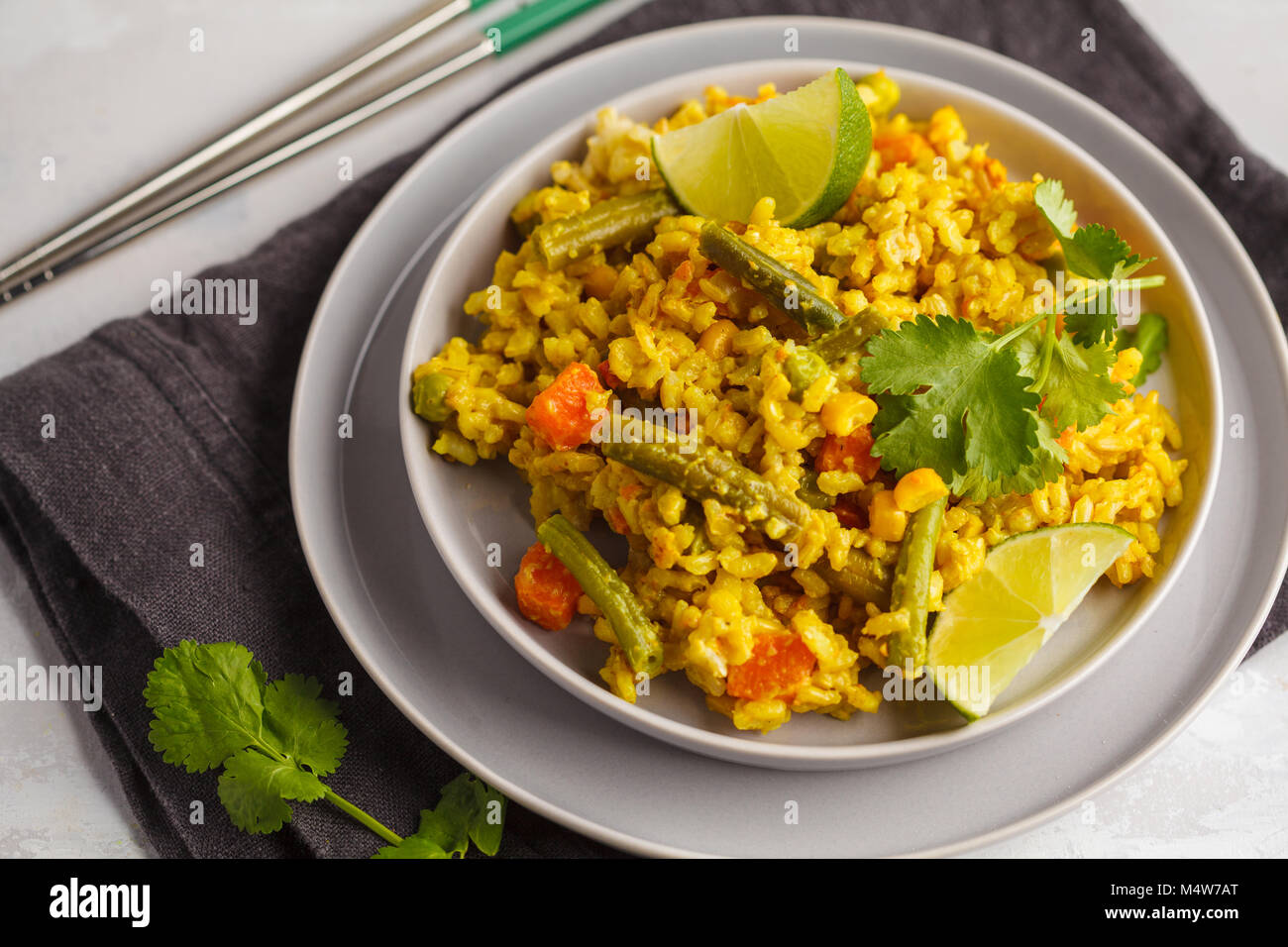 Vegetarian curry rice with vegetables in a gray plate. Healthy vegan ...