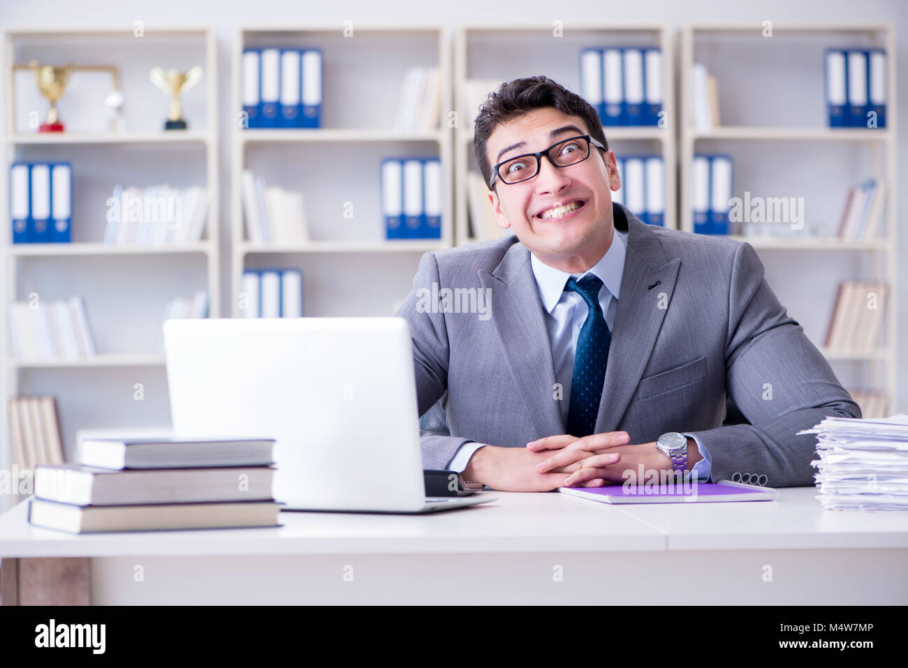 Funny businessman clown acting silly in the office Stock Photo - Alamy