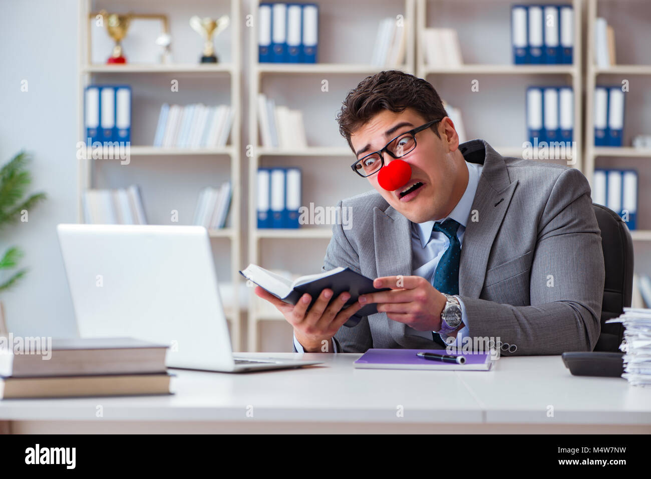 Clown businessman working in the office Stock Photo - Alamy