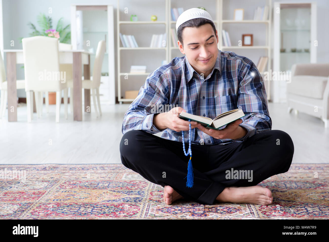 Muslim man praying at home Stock Photo - Alamy