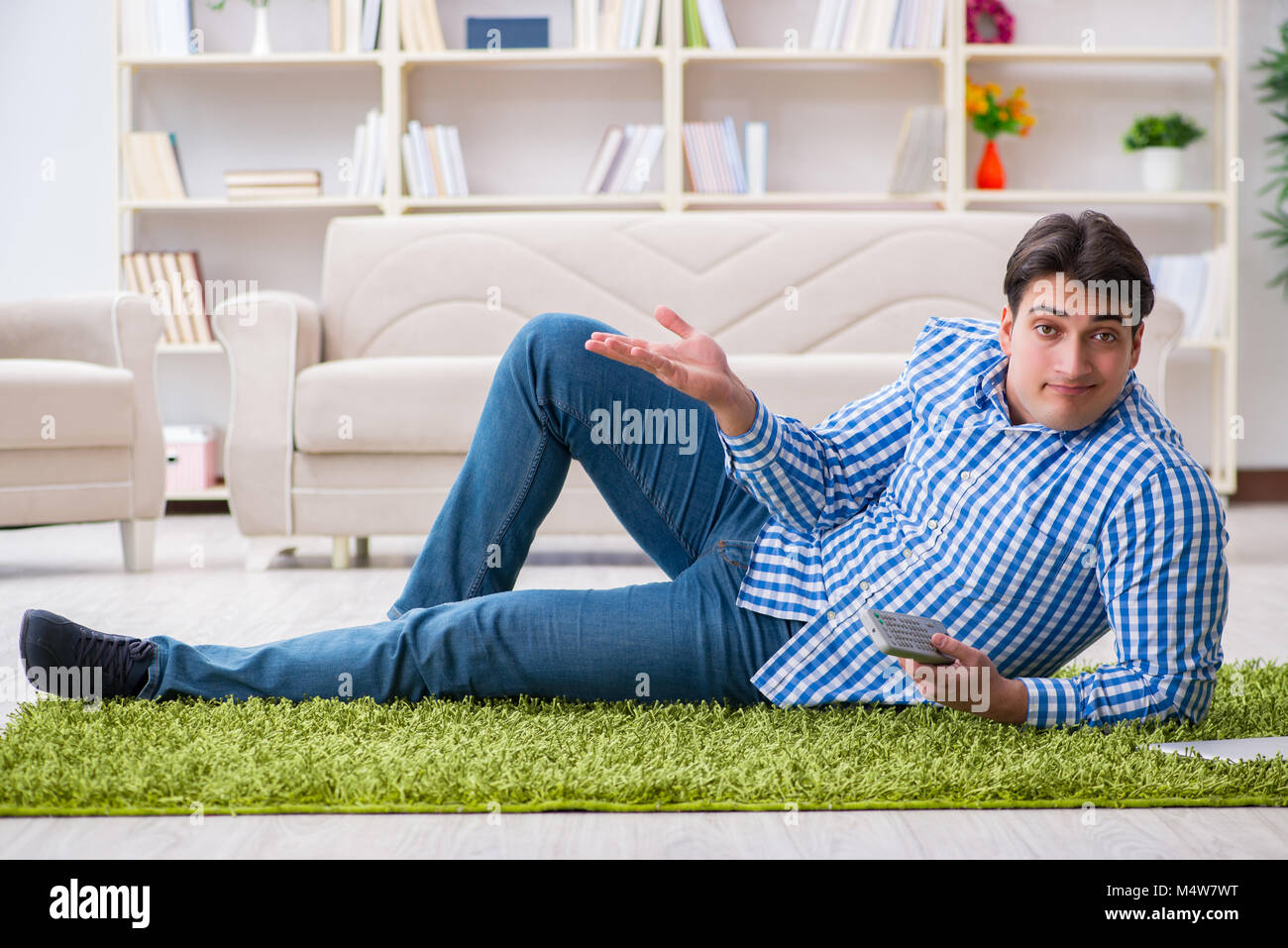 Tired man laying on the floor hi-res stock photography and images - Alamy