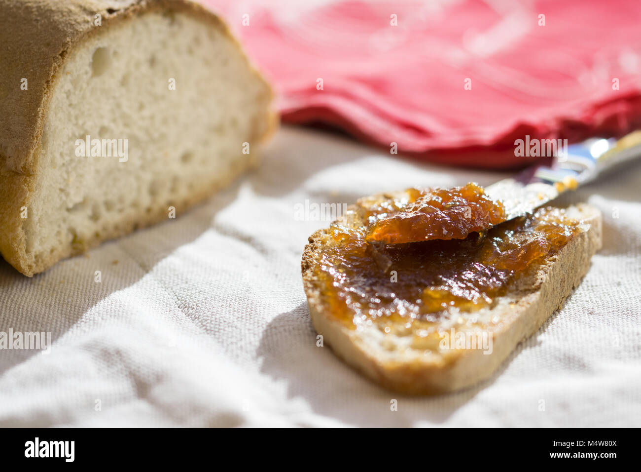 strawberry jam spread on a slice of bread Stock Photo - Alamy