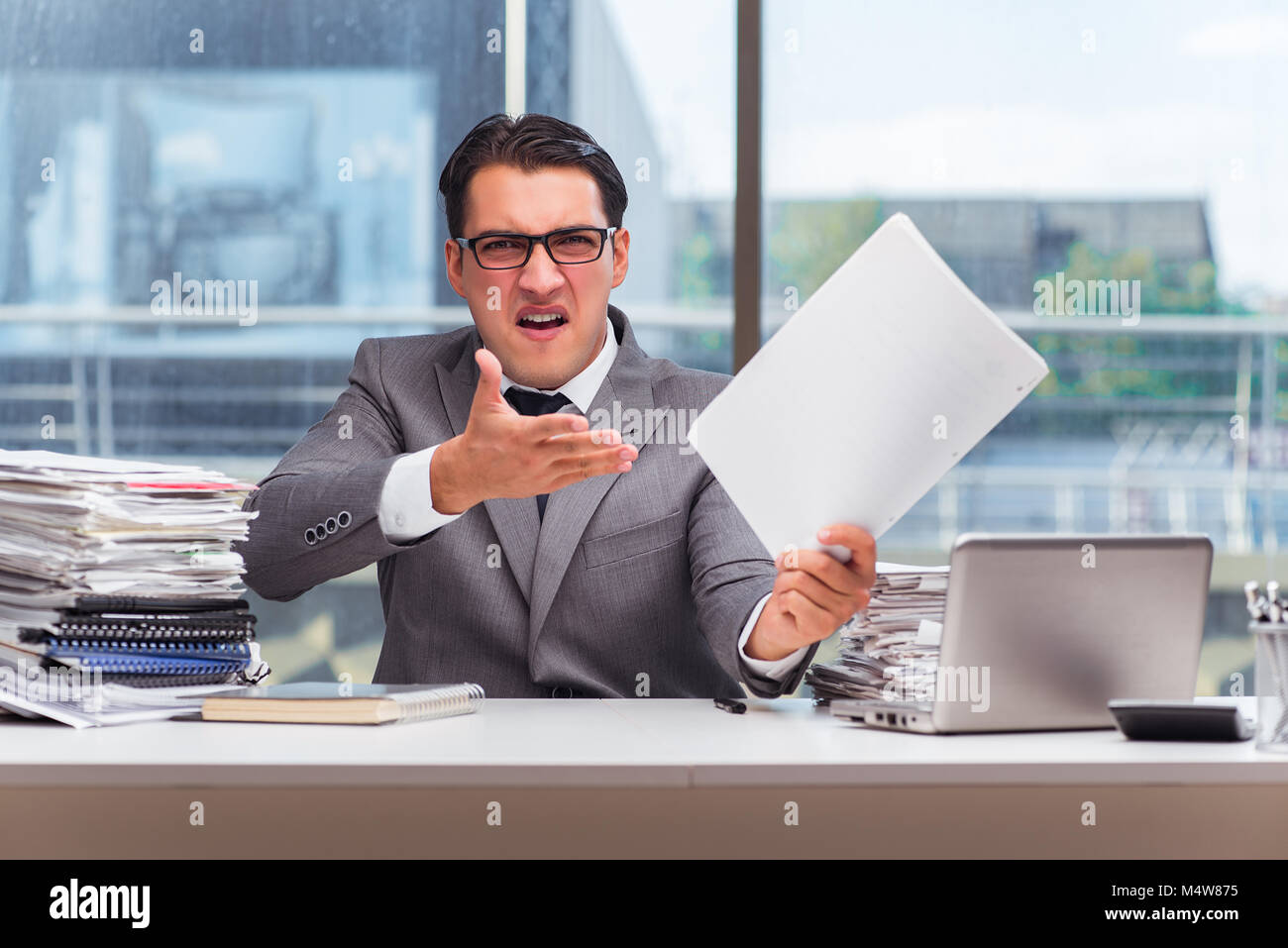 Angry businessman pointing paper hi-res stock photography and images ...