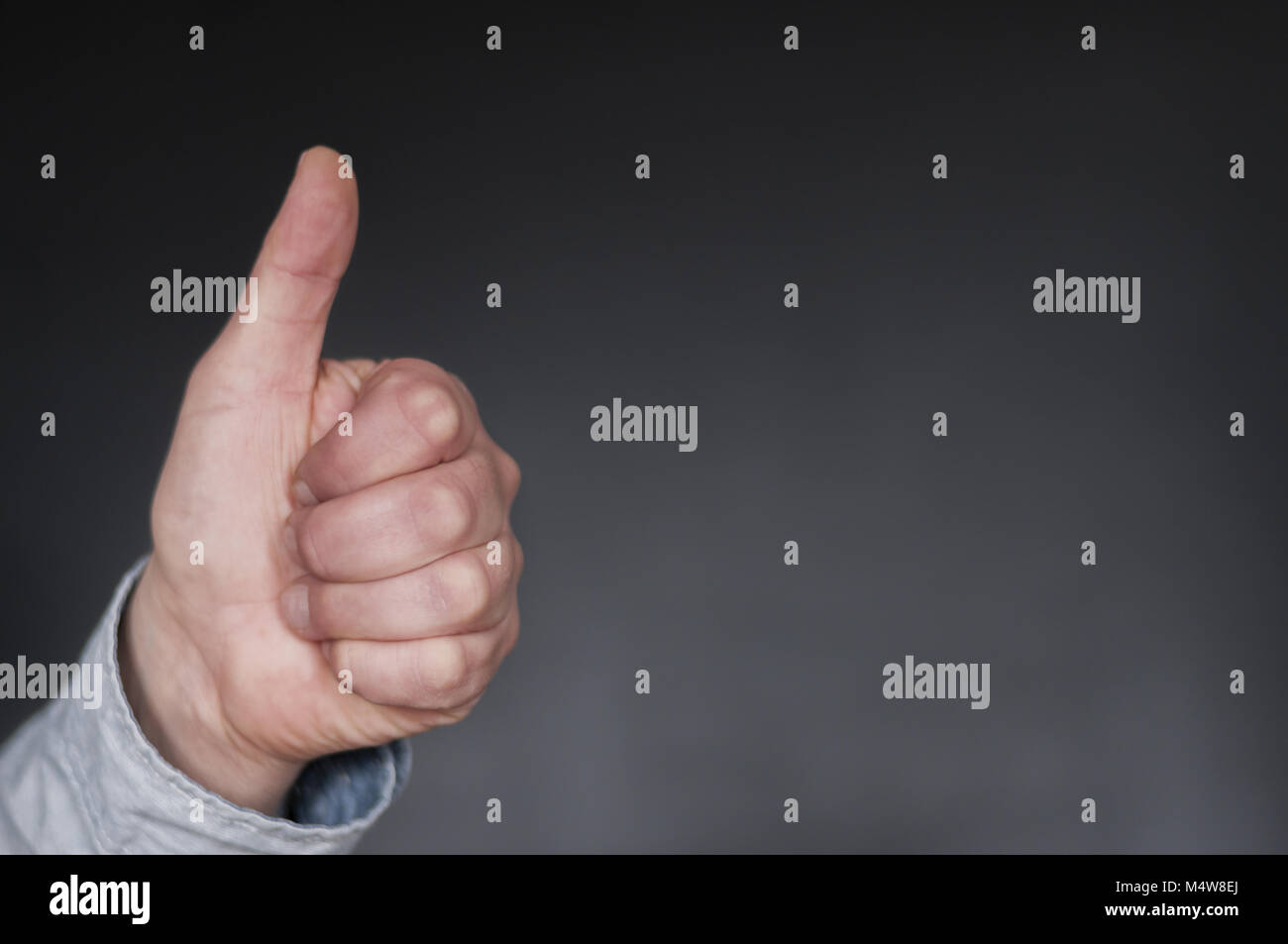 Hand with thumb up Stock Photo - Alamy
