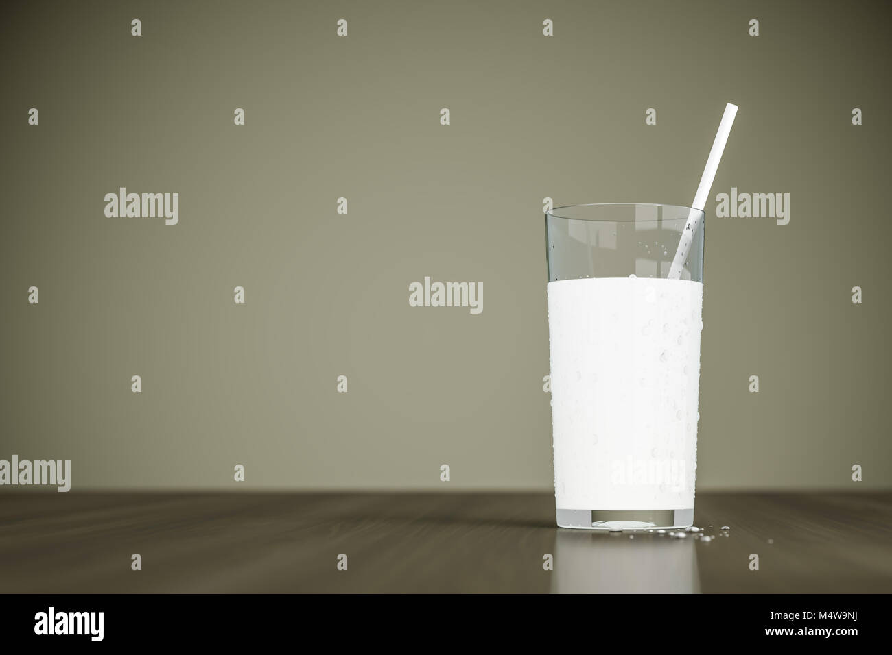 a glass of milk with a straw Stock Photo - Alamy