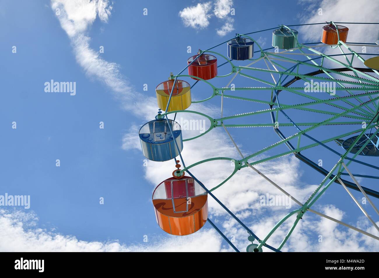 Ferris wheel in a summer amusement park Stock Photo - Alamy