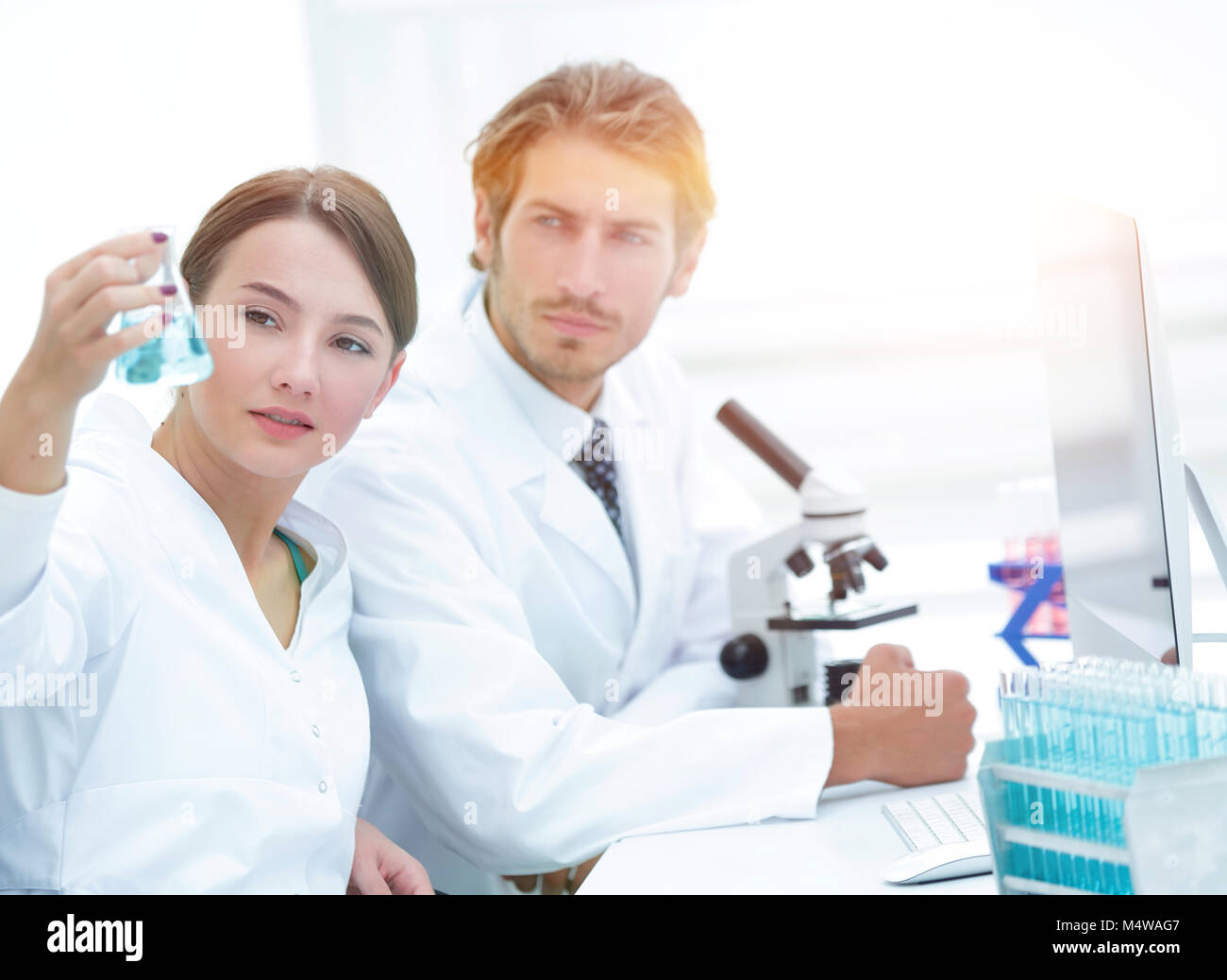 Team of Biologists Researchers Working in Laboratory Stock Photo - Alamy