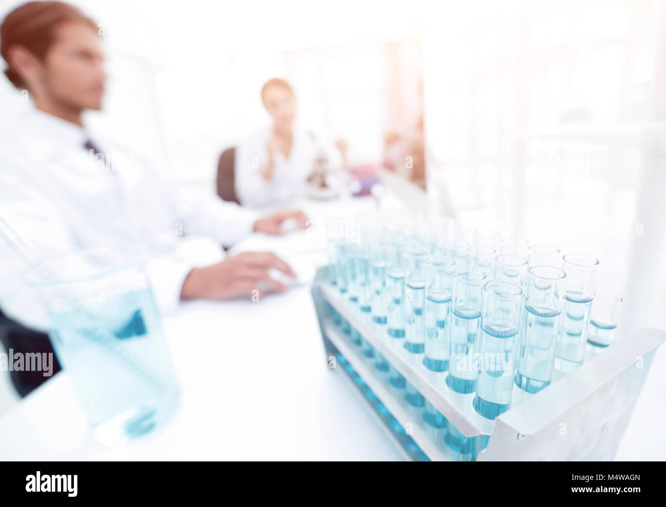 side view of scientists working in laboratory Stock Photo - Alamy