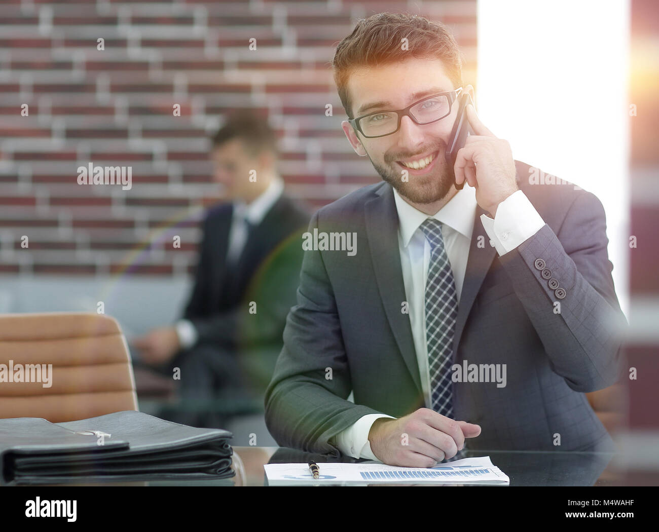 financial Manager sitting at his working place Stock Photo - Alamy