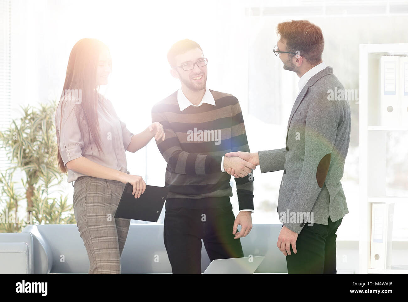 handshake Manager and employee in the office Stock Photo - Alamy