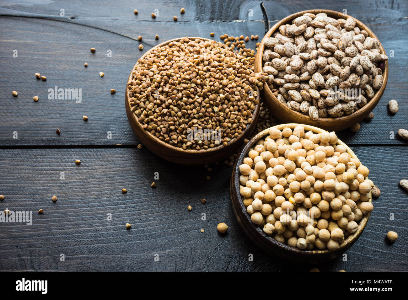 Organic superfood concept with raw chick peas, buckwheat, beans, rice ...