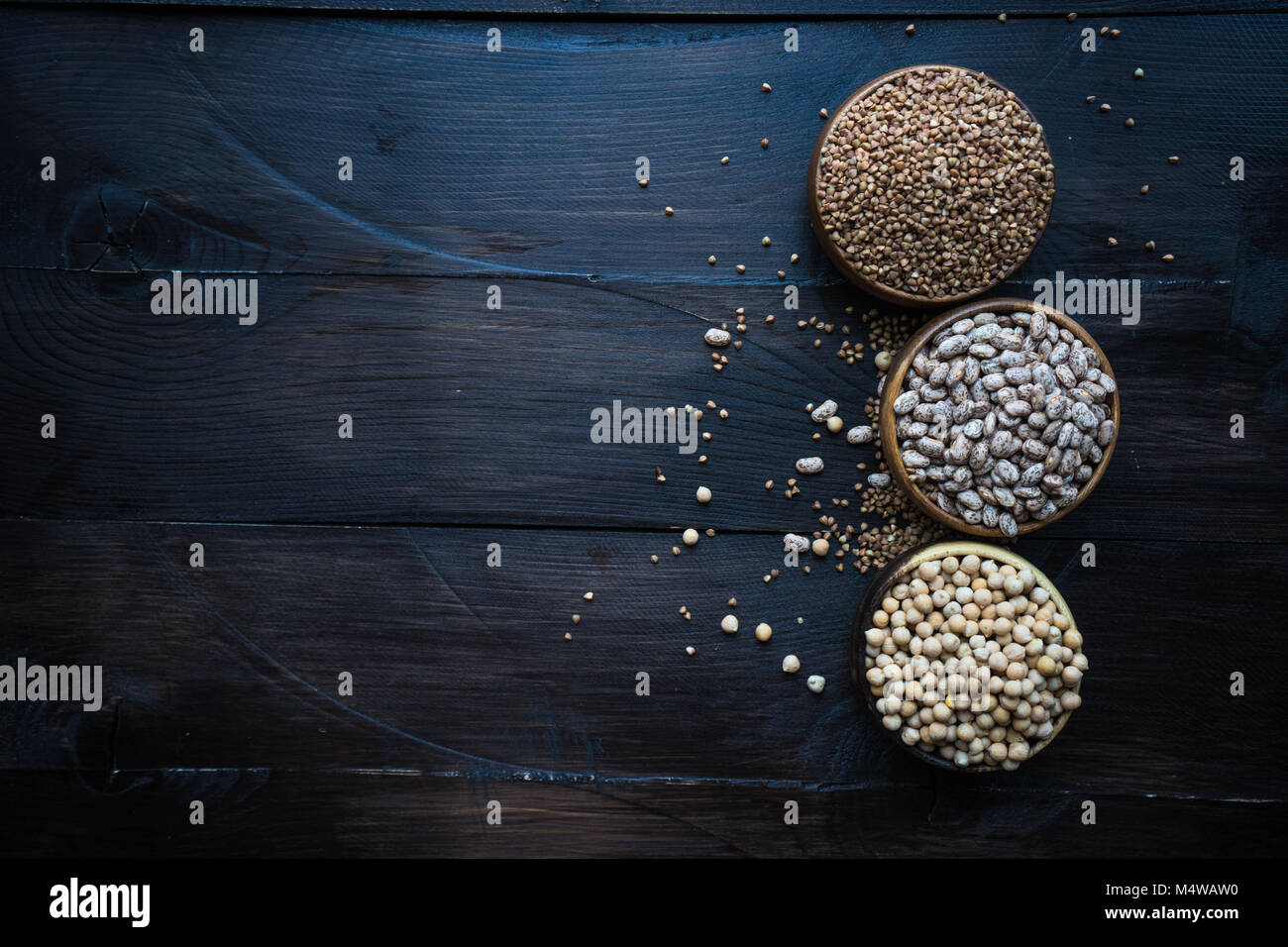 Organic superfood concept with raw chick peas, buckwheat, beans, rice ...