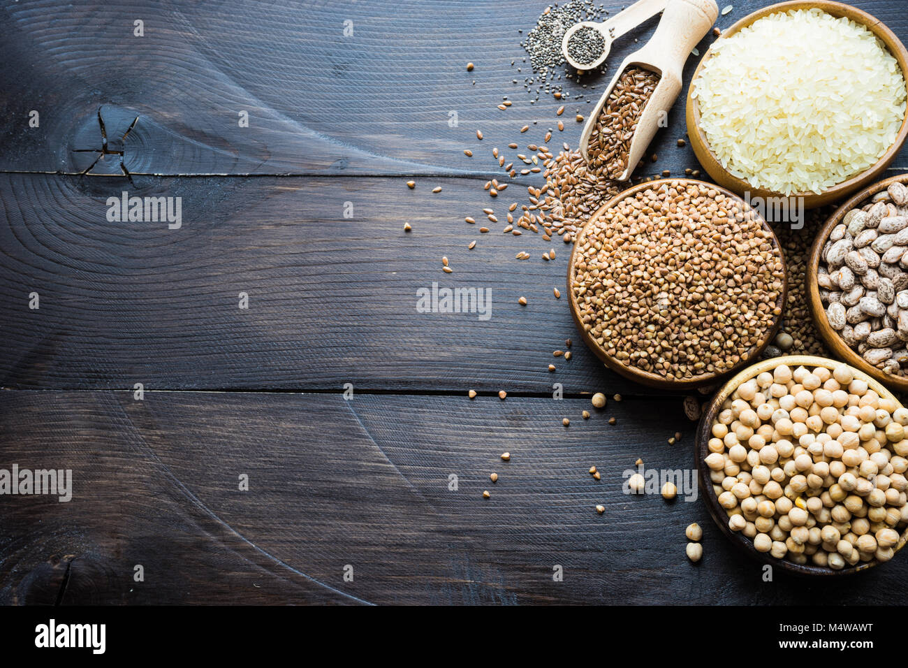 Organic superfood concept with raw chick peas, buckwheat, beans, rice ...