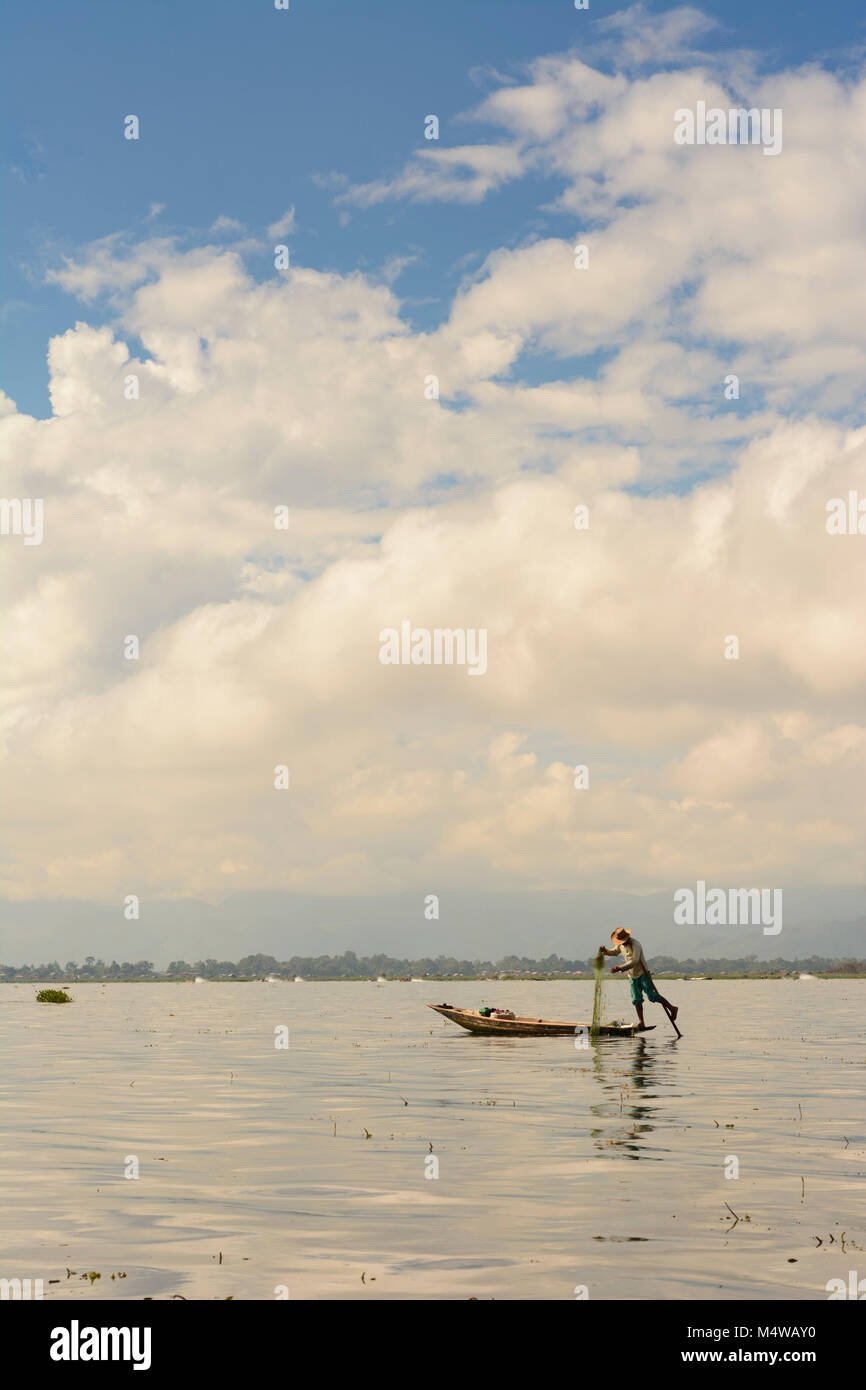 Nyaung Shwe: fisherman at Inle Lake, fishing net, leg rowing style ...