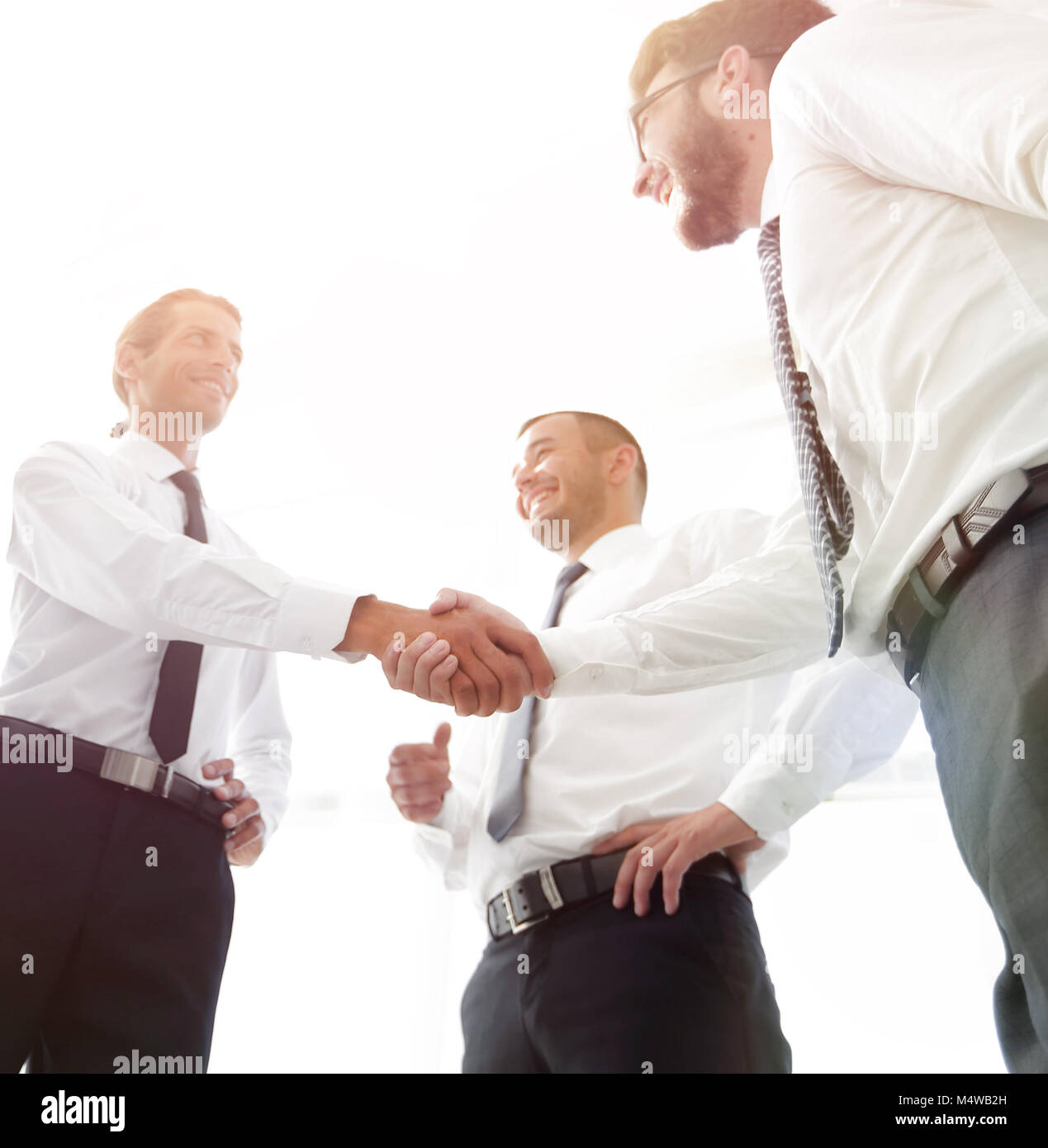 bottom view.handshake business colleagues Stock Photo - Alamy