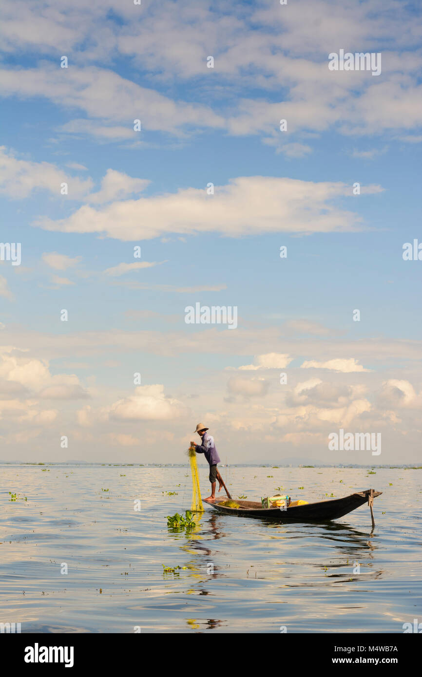 Nyaung Shwe: fisherman at Inle Lake, fishing net, leg rowing style ...