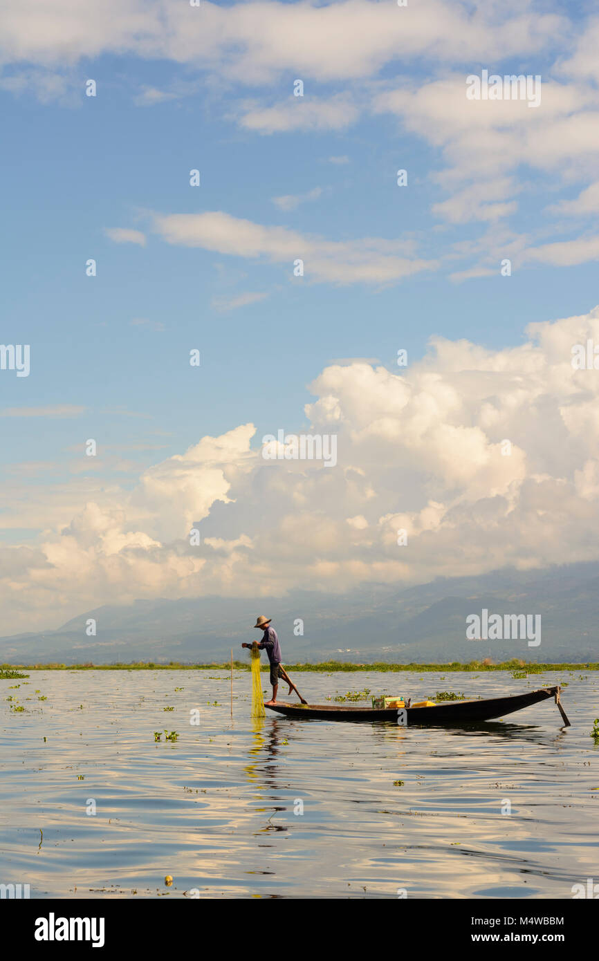 Nyaung Shwe: fisherman at Inle Lake, fishing net, leg rowing style ...