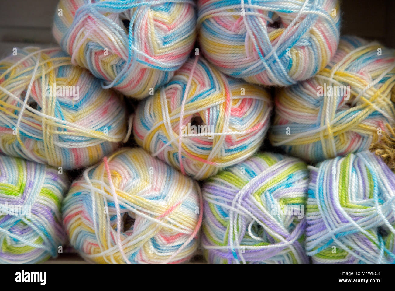 A pile of multi coloured knitting yarn Stock Photo - Alamy