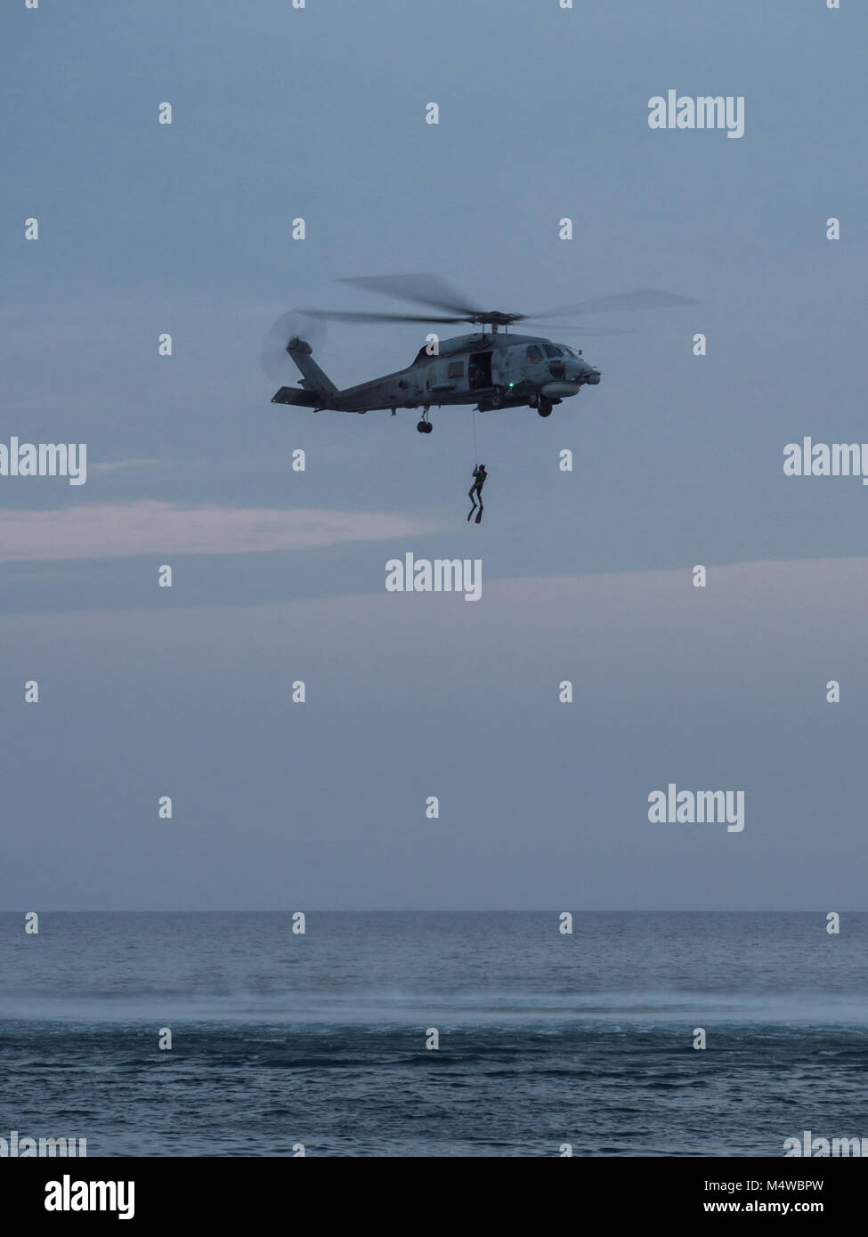 Soldier rescue demostration with a helicopter Stock Photo - Alamy