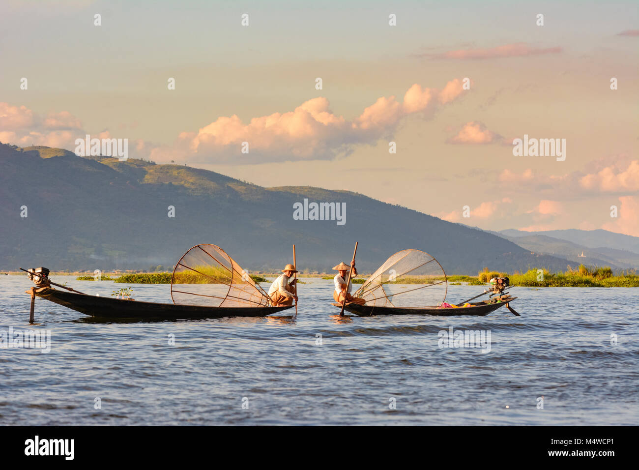 Nyaung Shwe: Fisherman at Inle Lake with traditional Intha conical net ...