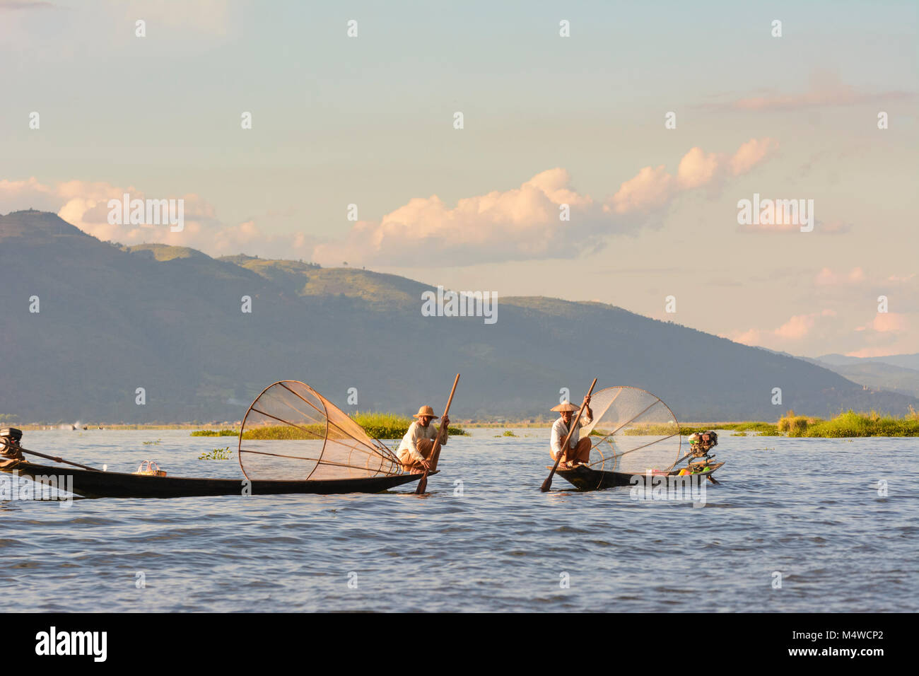 Nyaung Shwe: Fisherman at Inle Lake with traditional Intha conical net ...