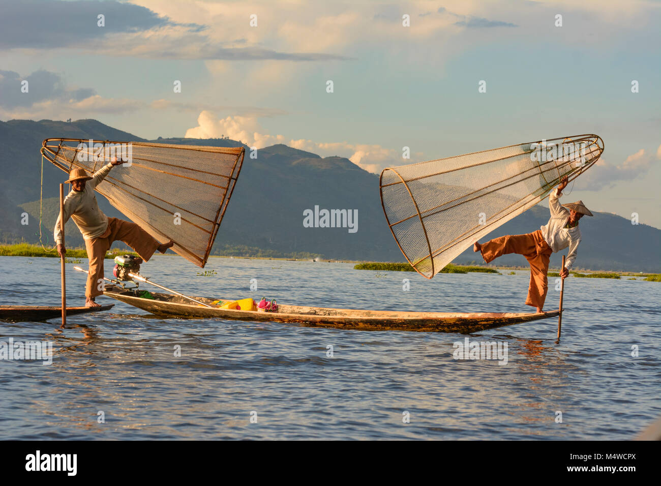Nyaung Shwe: Fisherman at Inle Lake with traditional Intha conical net ...
