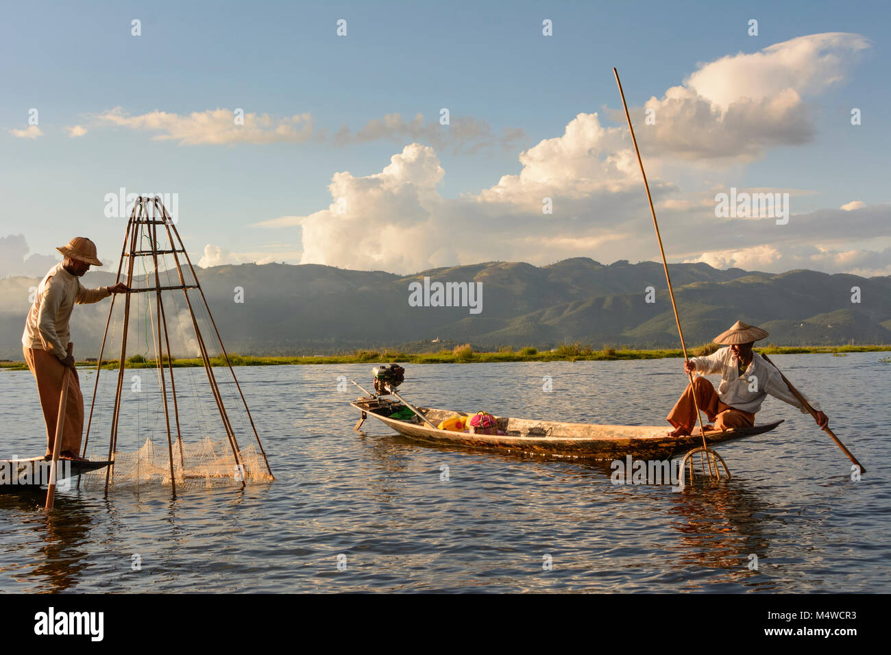 Nyaung Shwe: Fisherman at Inle Lake with traditional Intha conical net ...