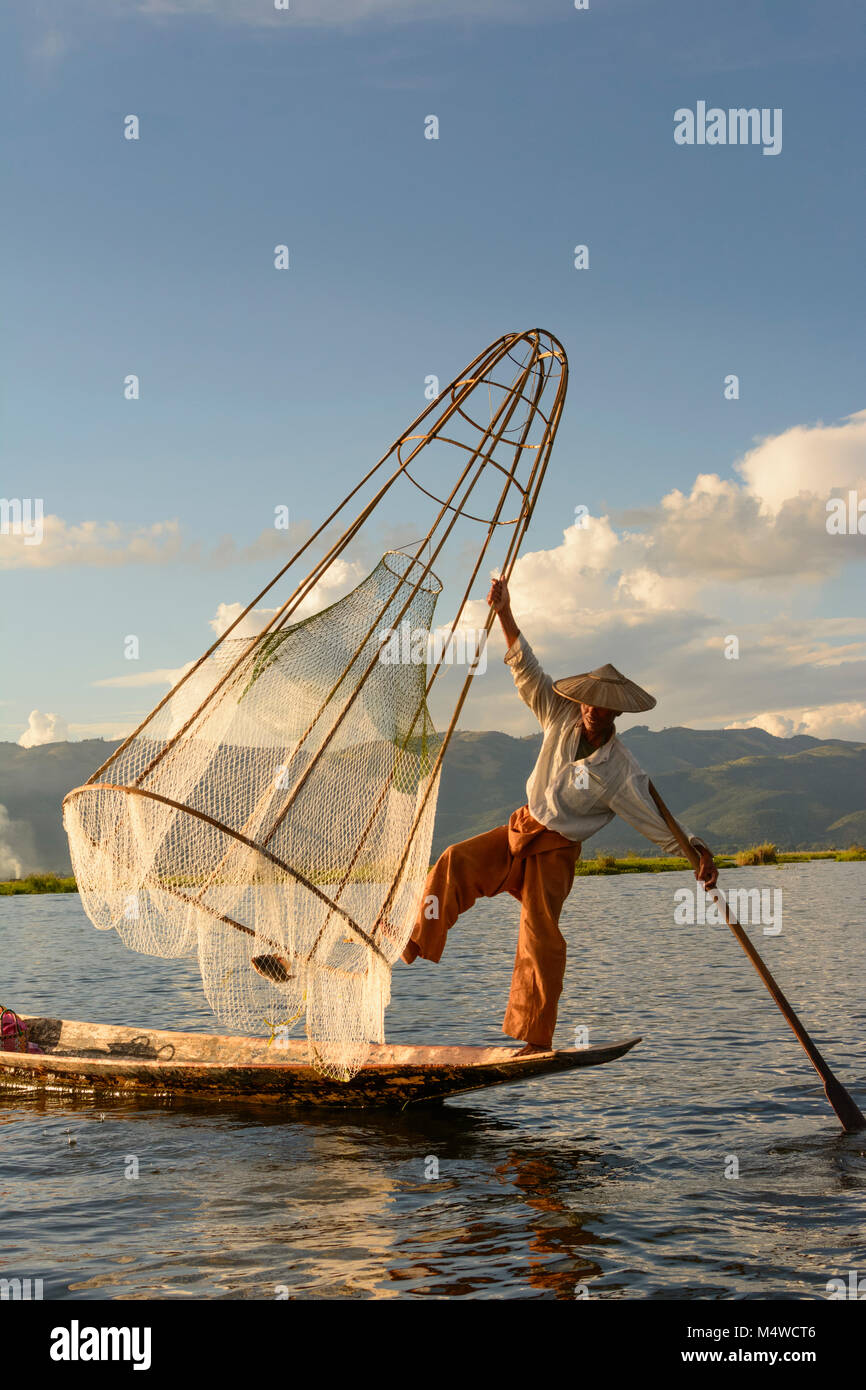 Nyaung Shwe: Fisherman at Inle Lake with traditional Intha conical net ...