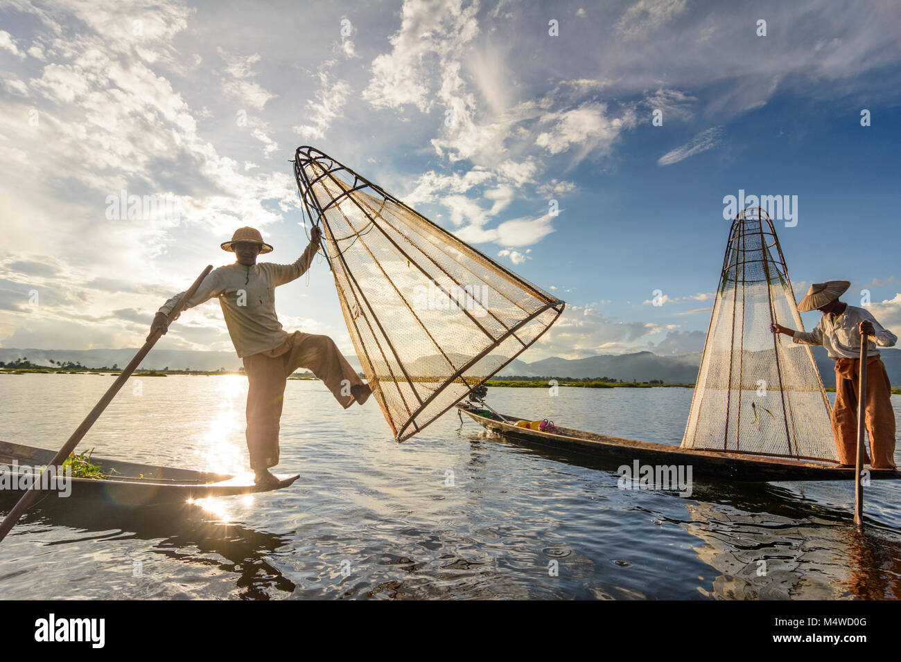 Nyaung Shwe: Fisherman at Inle Lake with traditional Intha conical net ...
